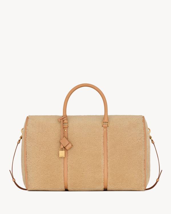 DUFFLE BAG IN SHEARLING in Beige | Saint Laurent | YSL EN-US