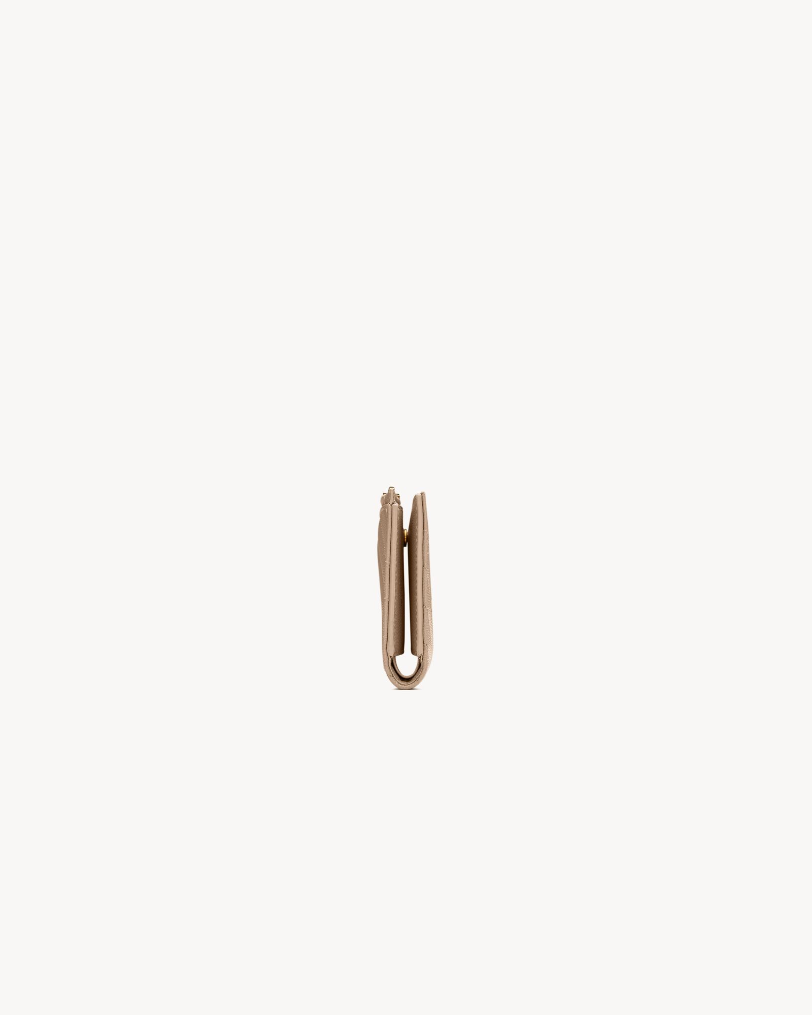 CASSANDRE MATELASSÉ Fragments Zipped bi-fold wallet in grain de poudre ...